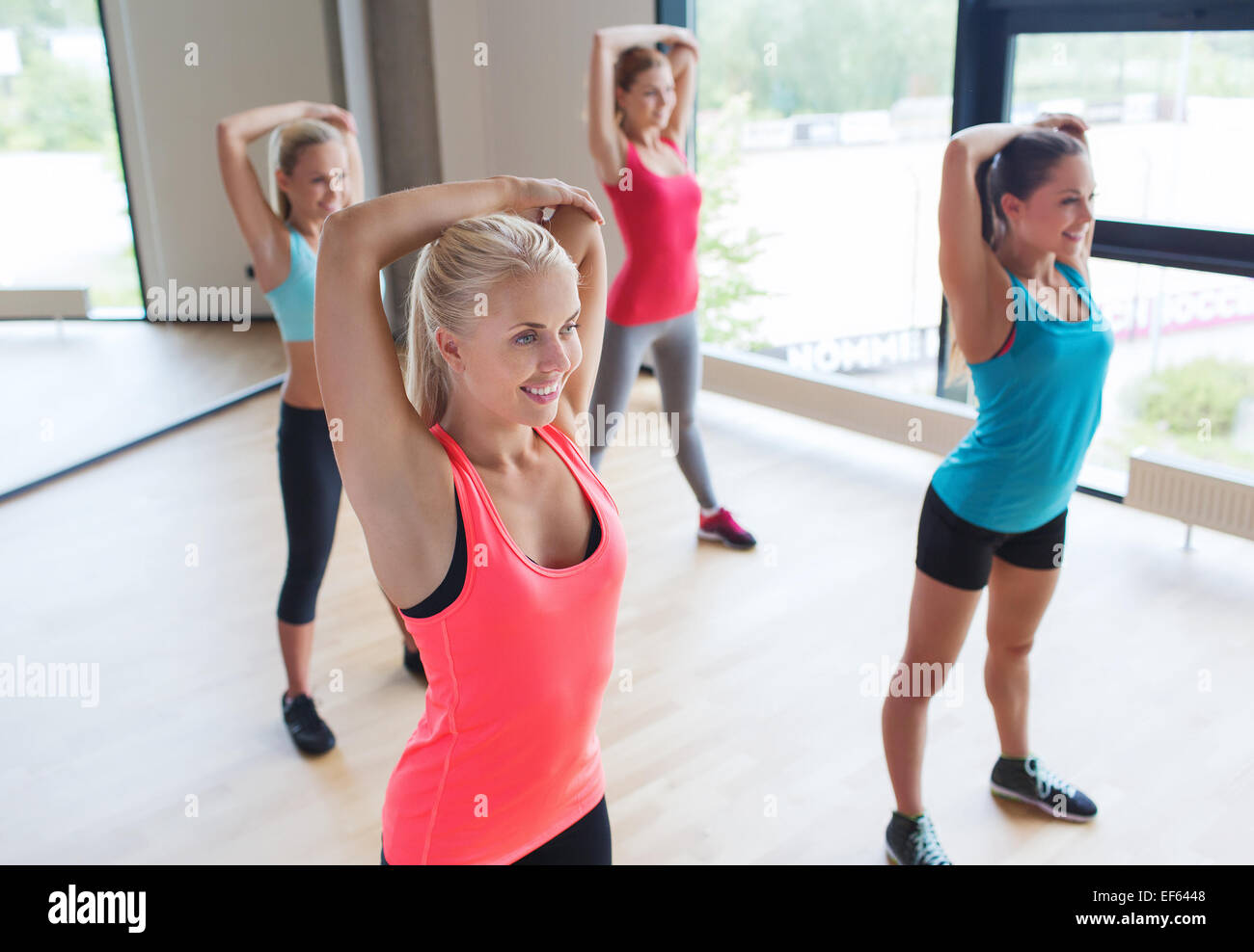 Happy group people stretching hands hi-res stock photography and images ...