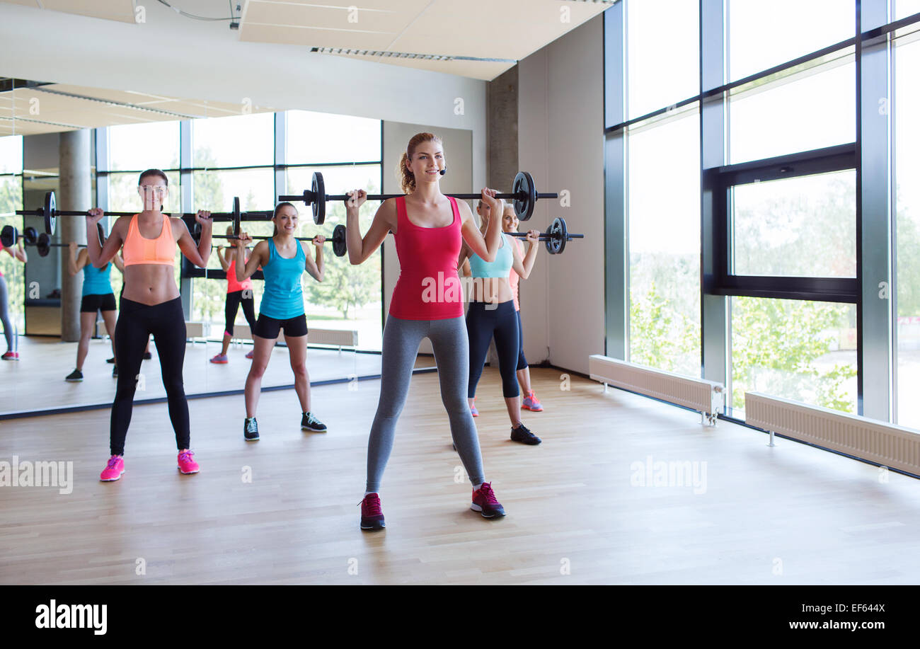 group of women excercising with bars in gym Stock Photo - Alamy