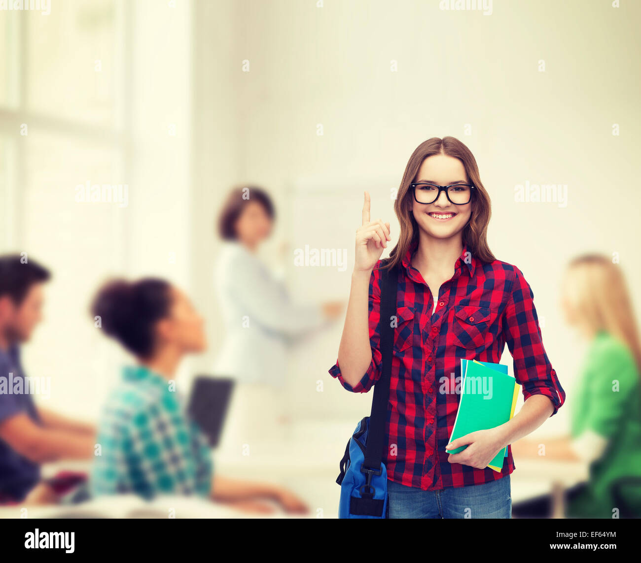 smiling female student with bag and notebooks Stock Photo - Alamy