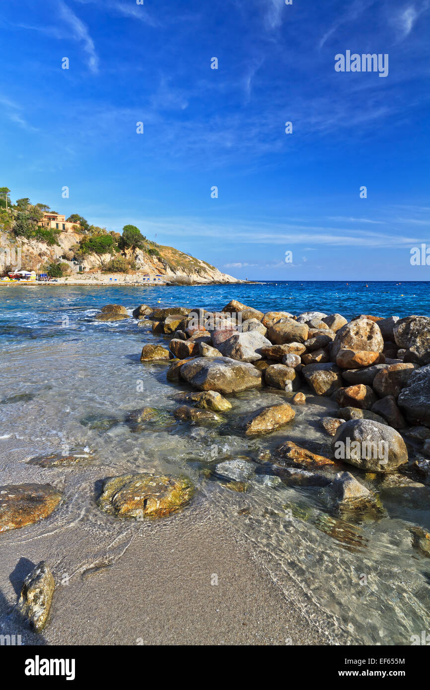 view of Saint Andrea village from the sandy beach, Elba island, Italy ...
