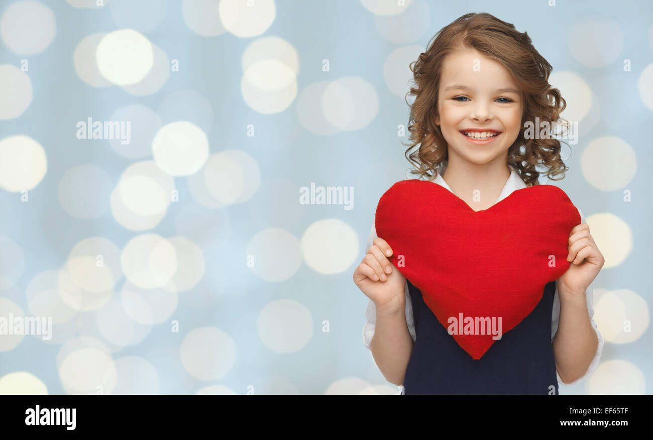 smiling little girl with red heart Stock Photo - Alamy