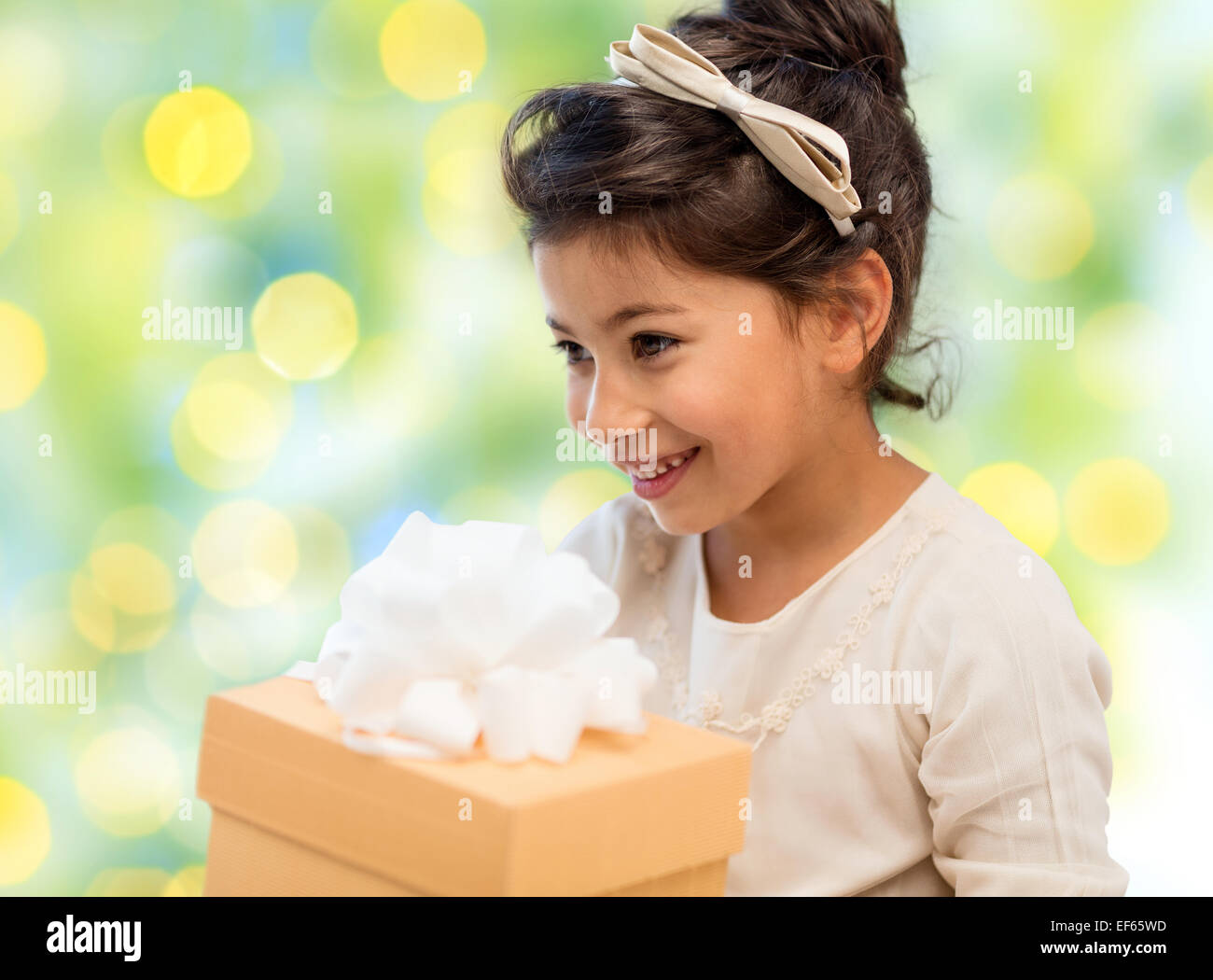 happy little girl with gift box Stock Photo - Alamy