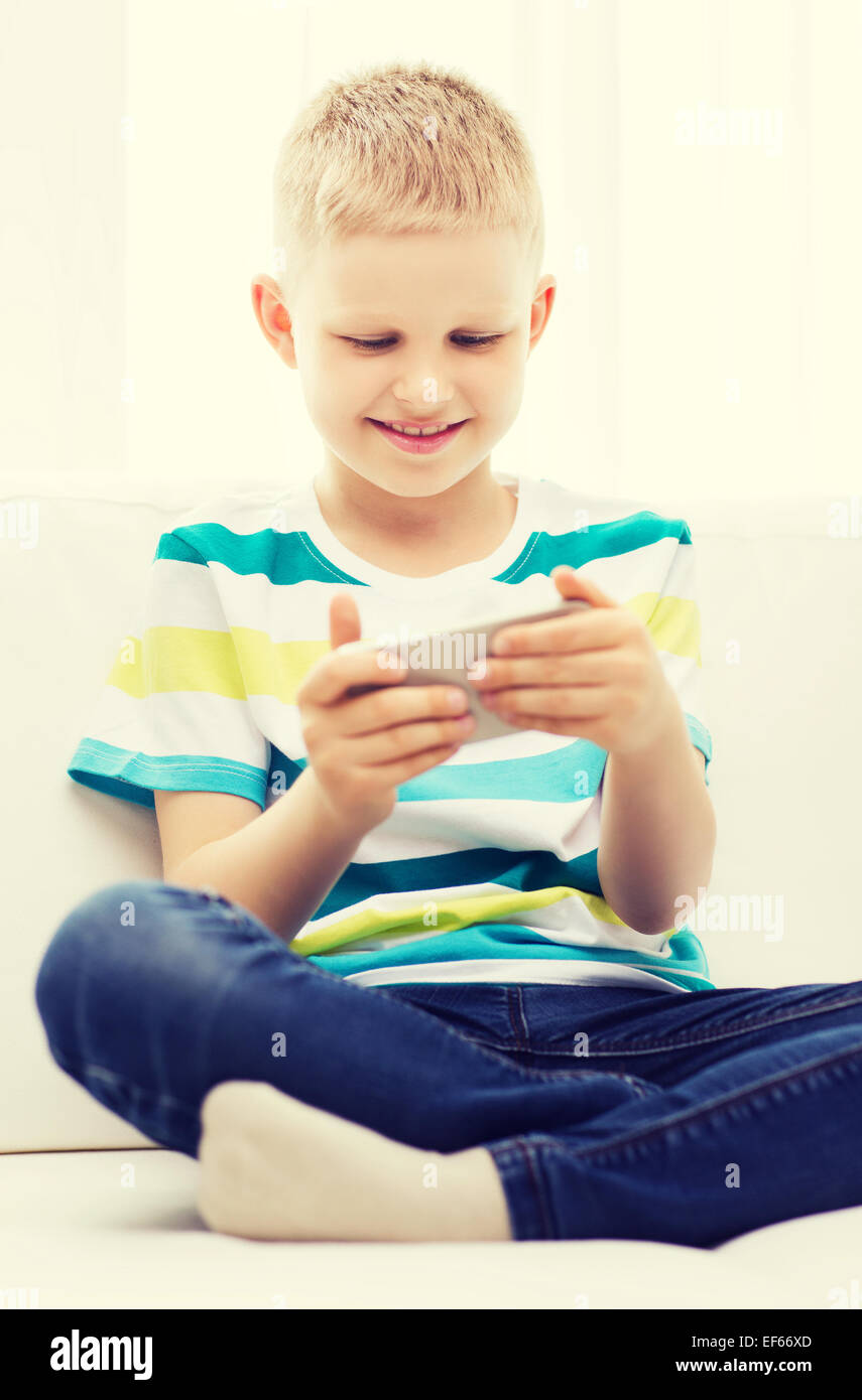 smiling little boy with smartphone Stock Photo - Alamy