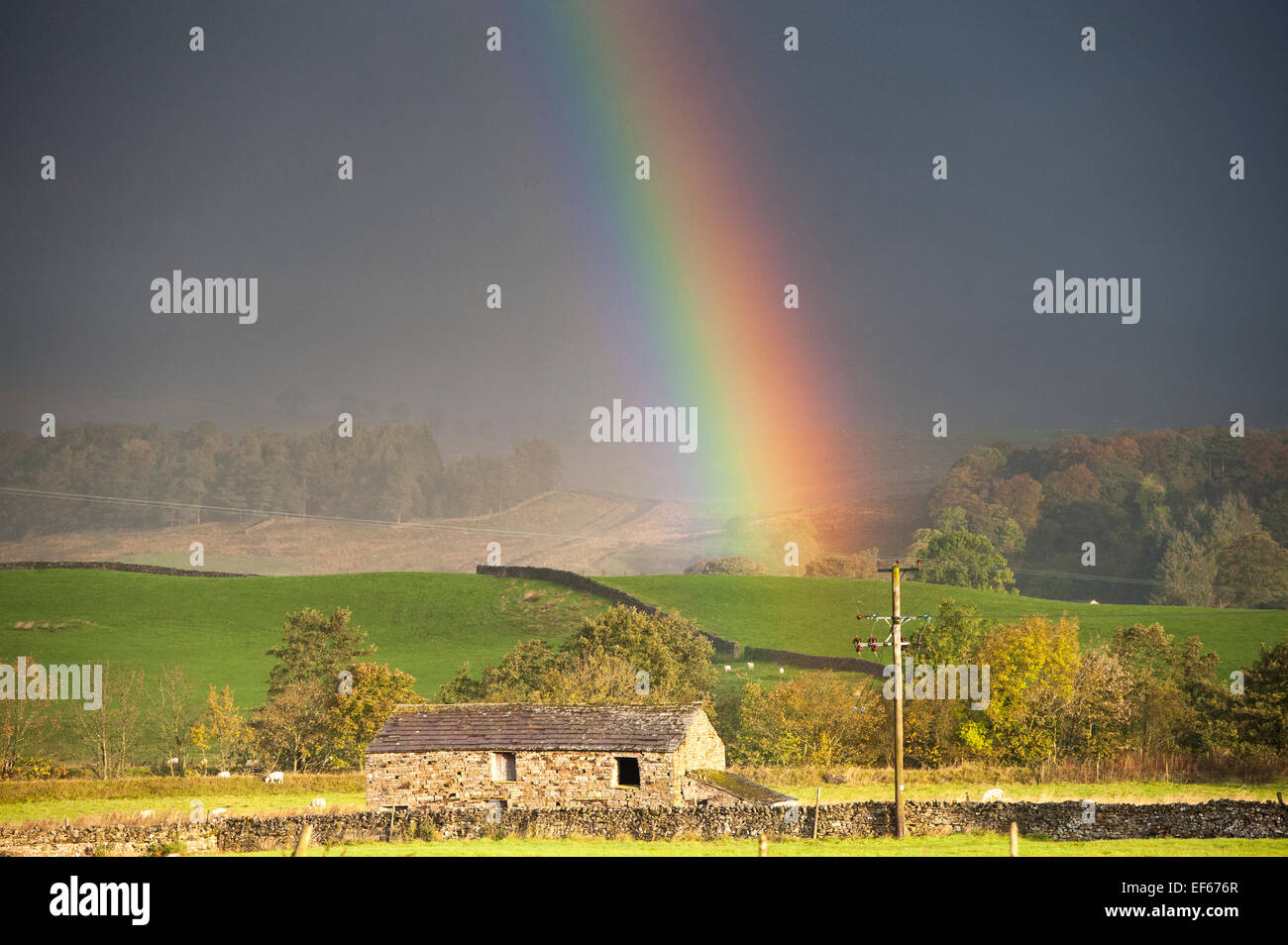 Rainbow over an old stone barn in Wensleydale, North Yorkshire, UK ...