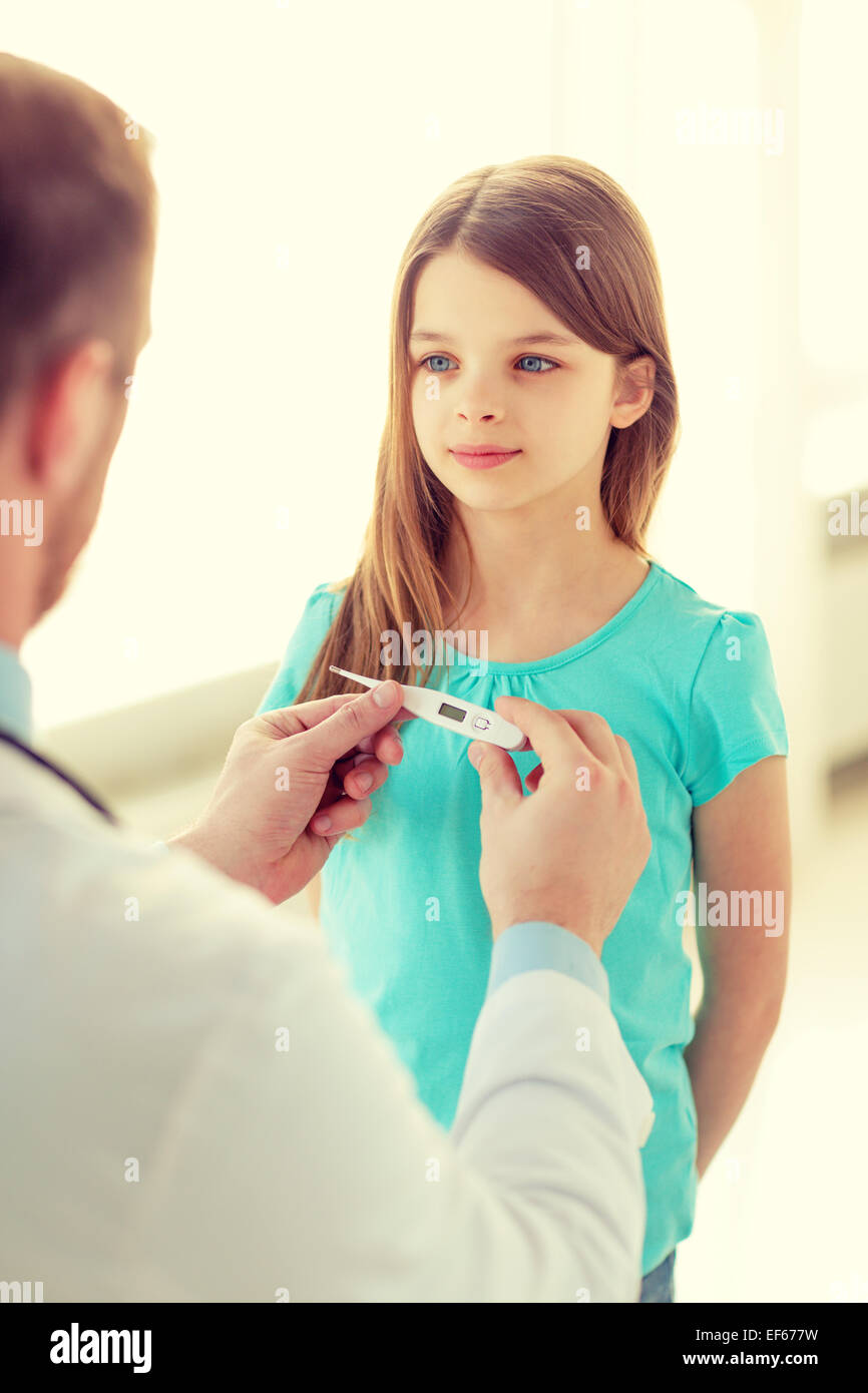 male doctor with child measuring temperature Stock Photo - Alamy