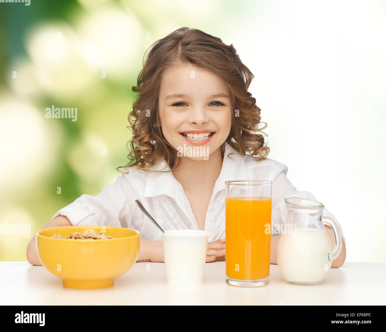 happy girl eating healthy breakfast Stock Photo - Alamy