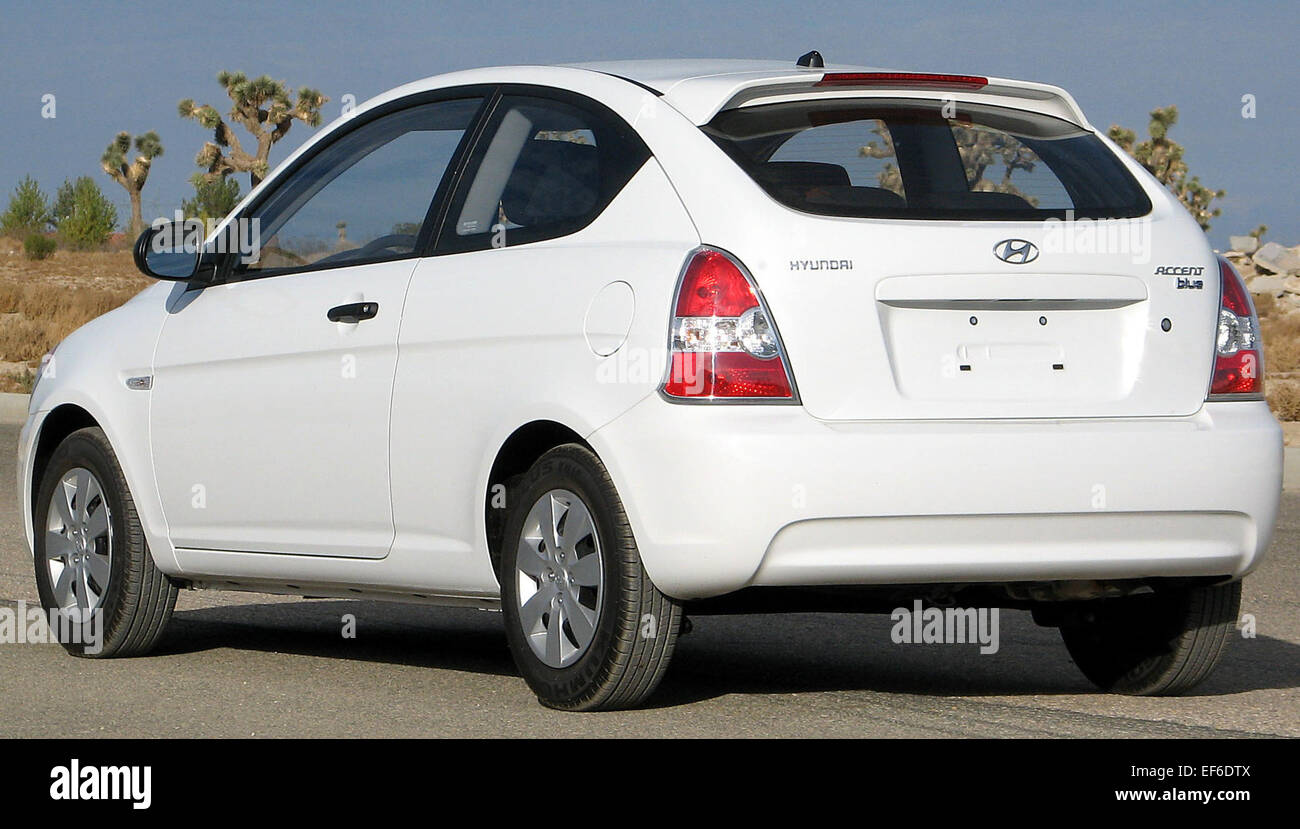The rear view of the 2010 Hyundai Accent Blue hatchback showcases its ...