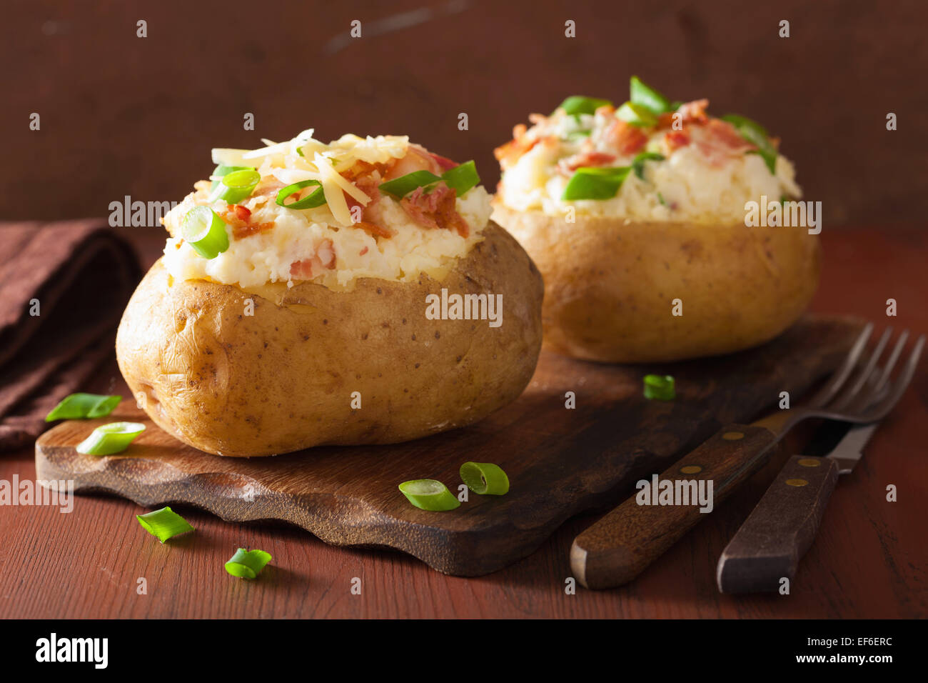 baked potato in jacket with bacon and cheese Stock Photo - Alamy
