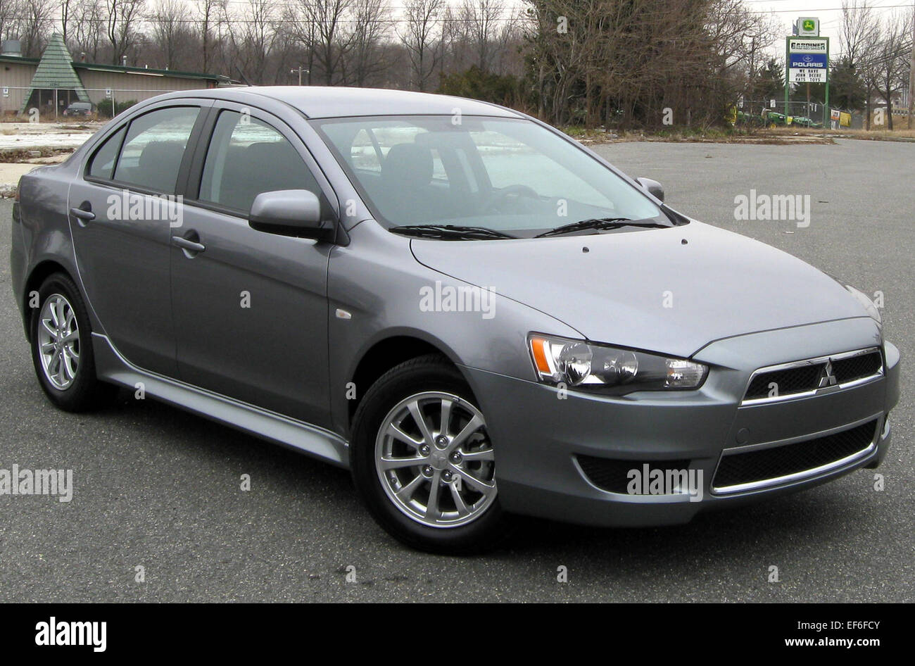 The 2012 Mitsubishi Lancer SE sedan is a compact car offering a sport ...
