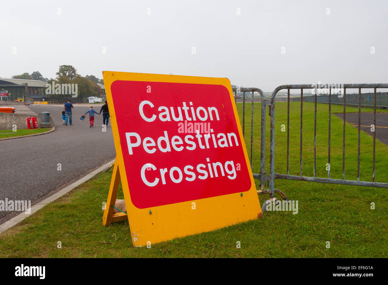 Sign Caution Pedestrian Crossing, in England, UK Stock Photo - Alamy