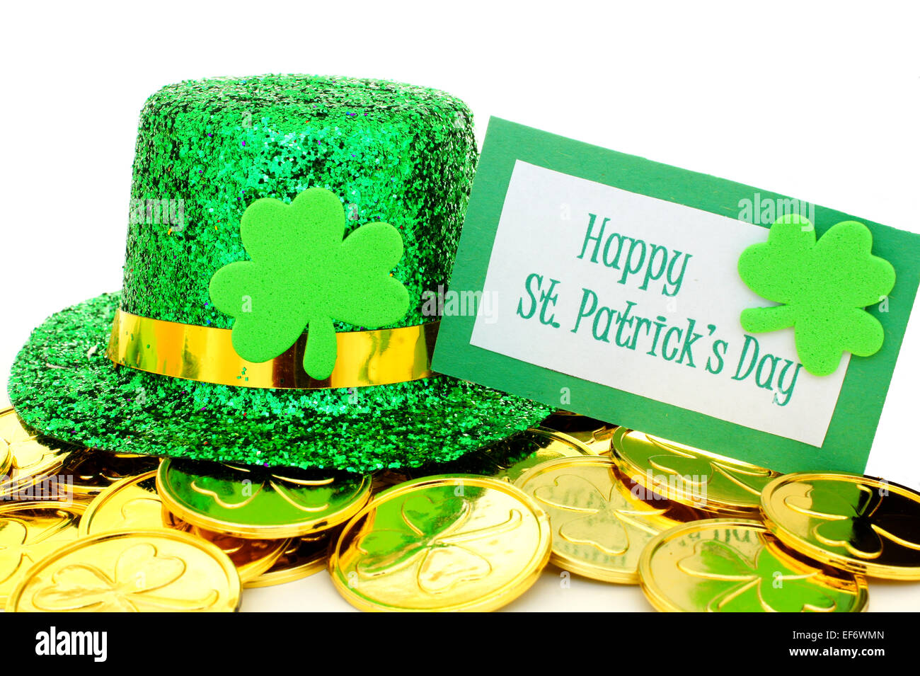 Happy St Patricks Day tag with party hat and gold coins over white ...