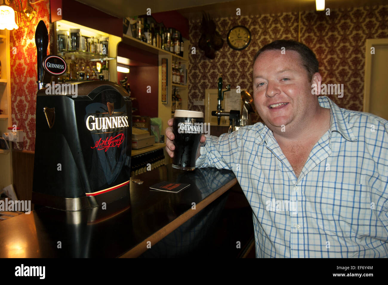 A man drinks a pint of Guinness, Portumna, County Galway, Ireland Stock ...
