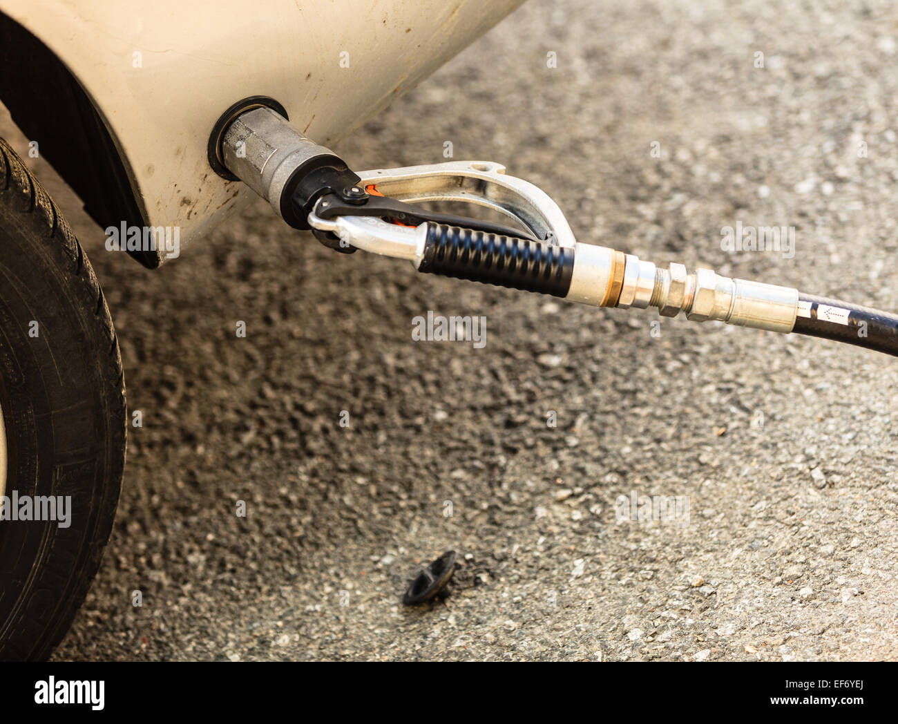 Auto refuel. Car at gas station being filled with fuel, fill up of ...