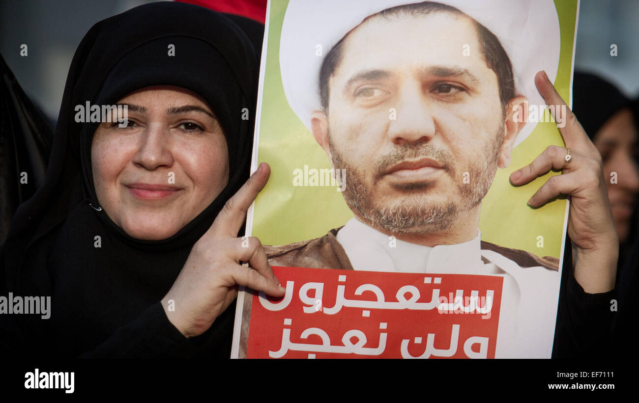 Protester carries a portrait of Sheikh Ali Salman as Bahraini security ...