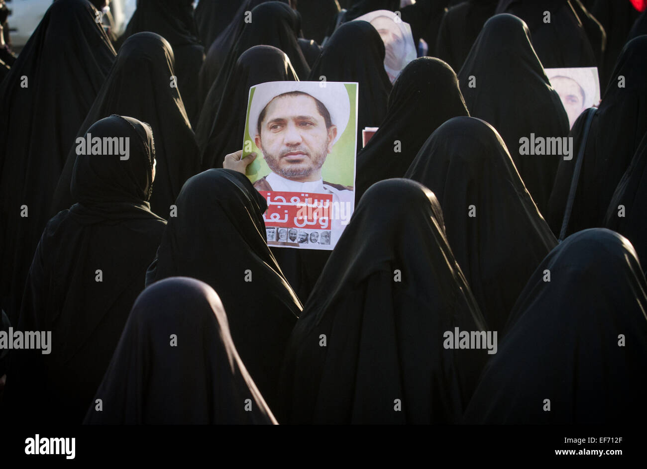 Protester carries a portrait of Sheikh Ali Salman as Bahraini security ...