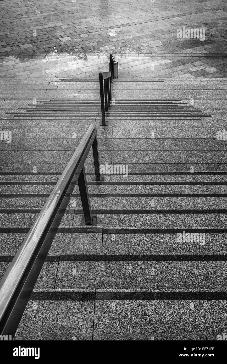 Dramatic image in black and white of stairs leading down stock concept ...