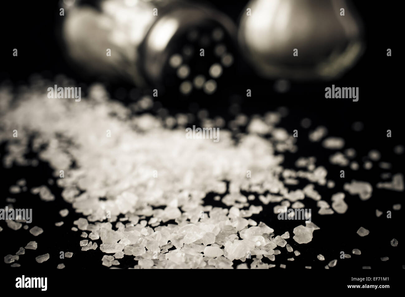 Two glass salt shakers and salt Stock Photo - Alamy
