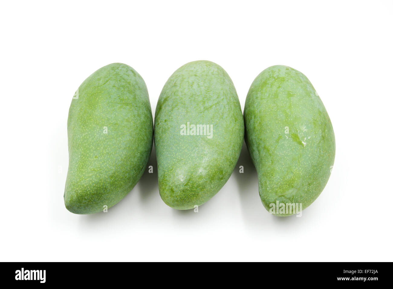 Green mango isolated on a white background Stock Photo - Alamy