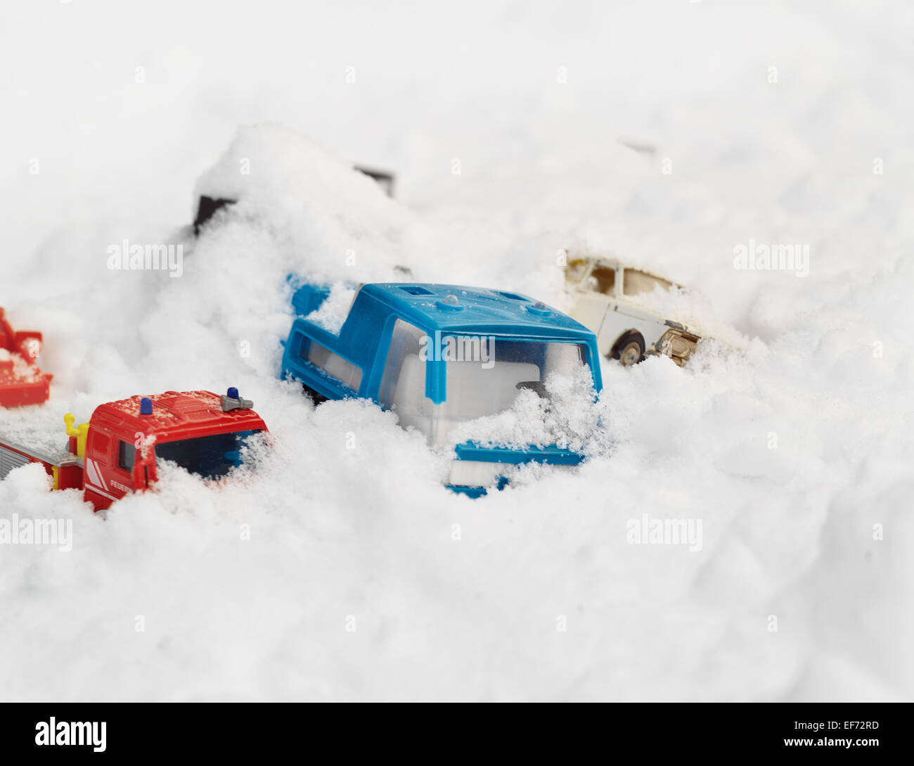 Toy cars stuck in snow Stock Photo - Alamy