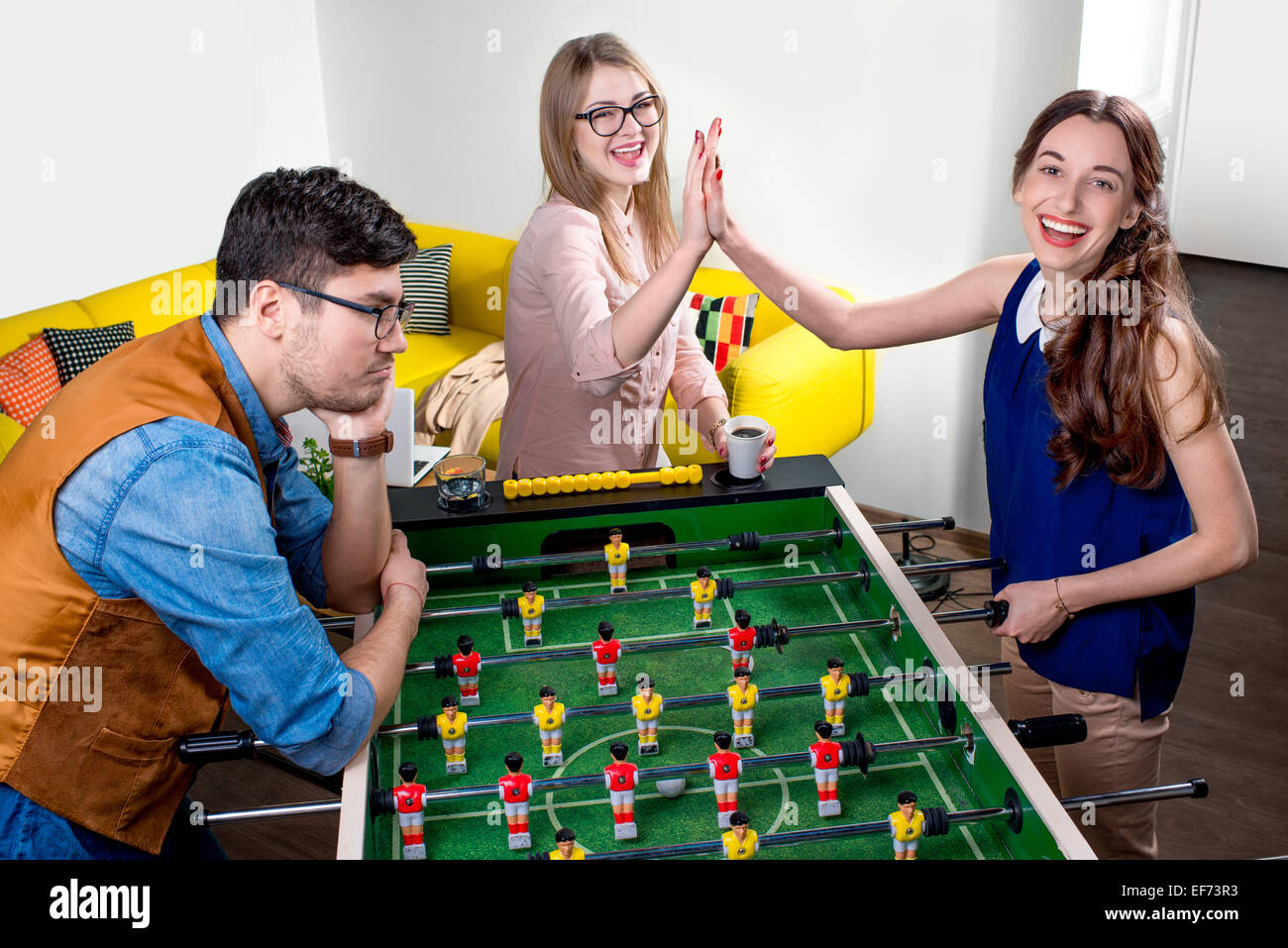 Table football playing hi-res stock photography and images - Alamy