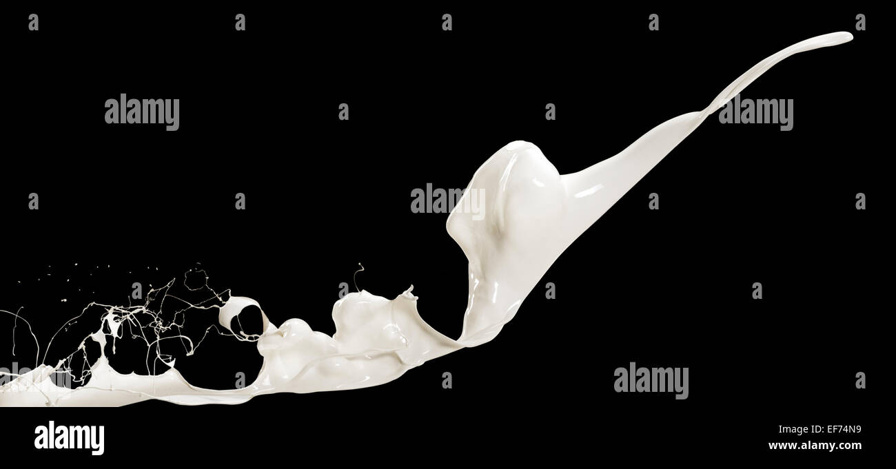 flying splashing milk isolated on black background Stock Photo - Alamy