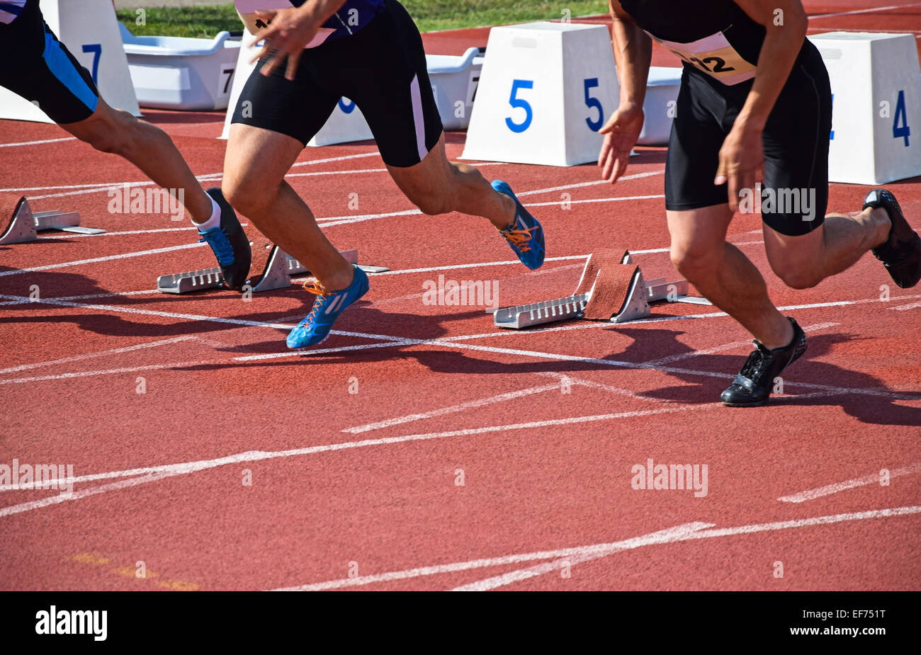 Runners are starting on the running track Stock Photo - Alamy