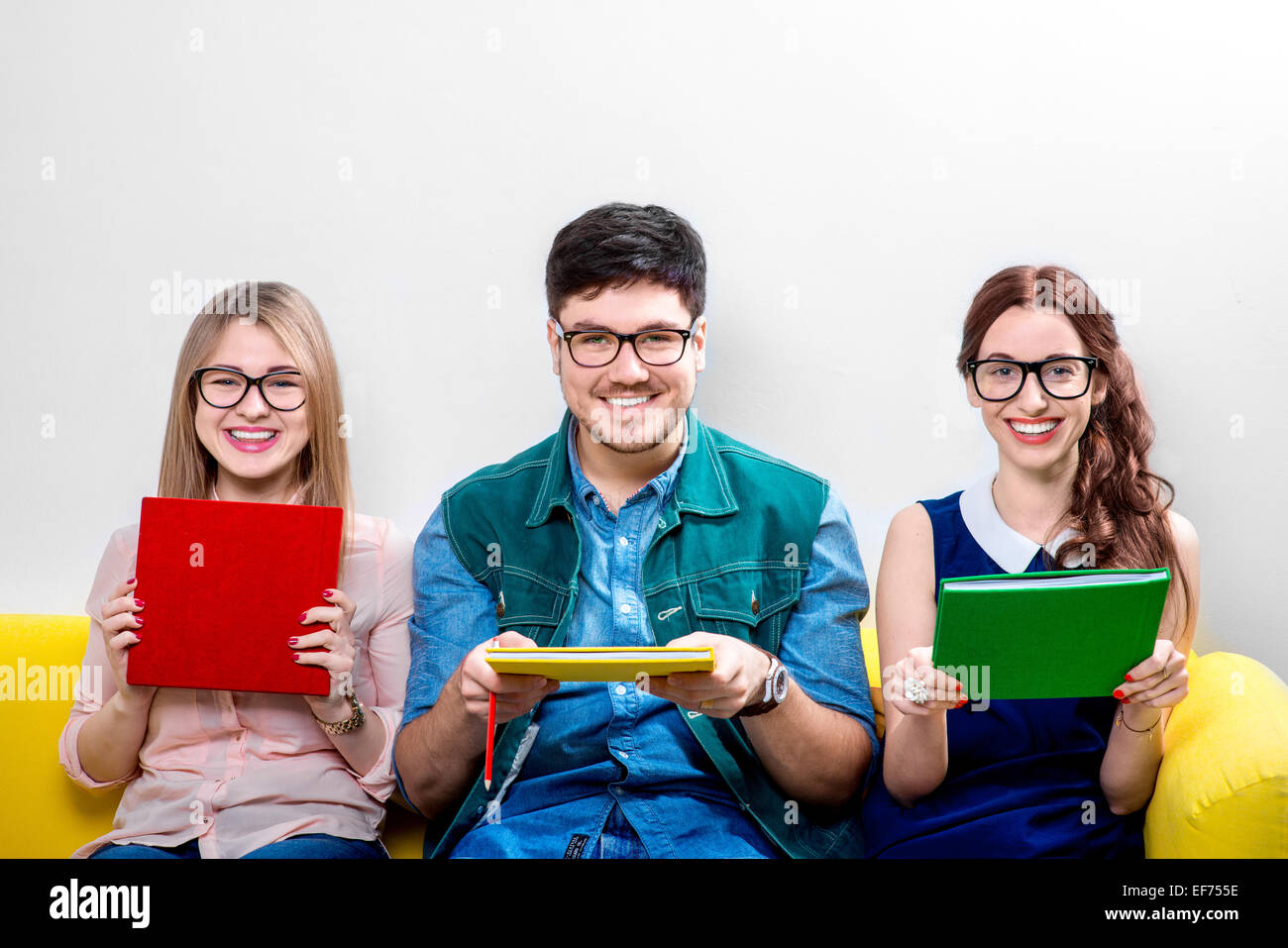 Students working on the couch Stock Photo - Alamy