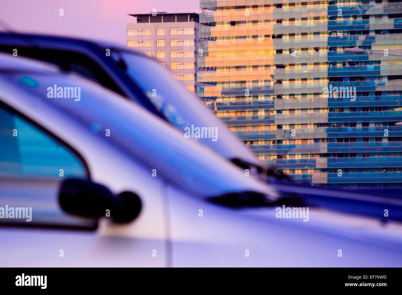 Close-up of two cars. Office building background. Transport to work ...