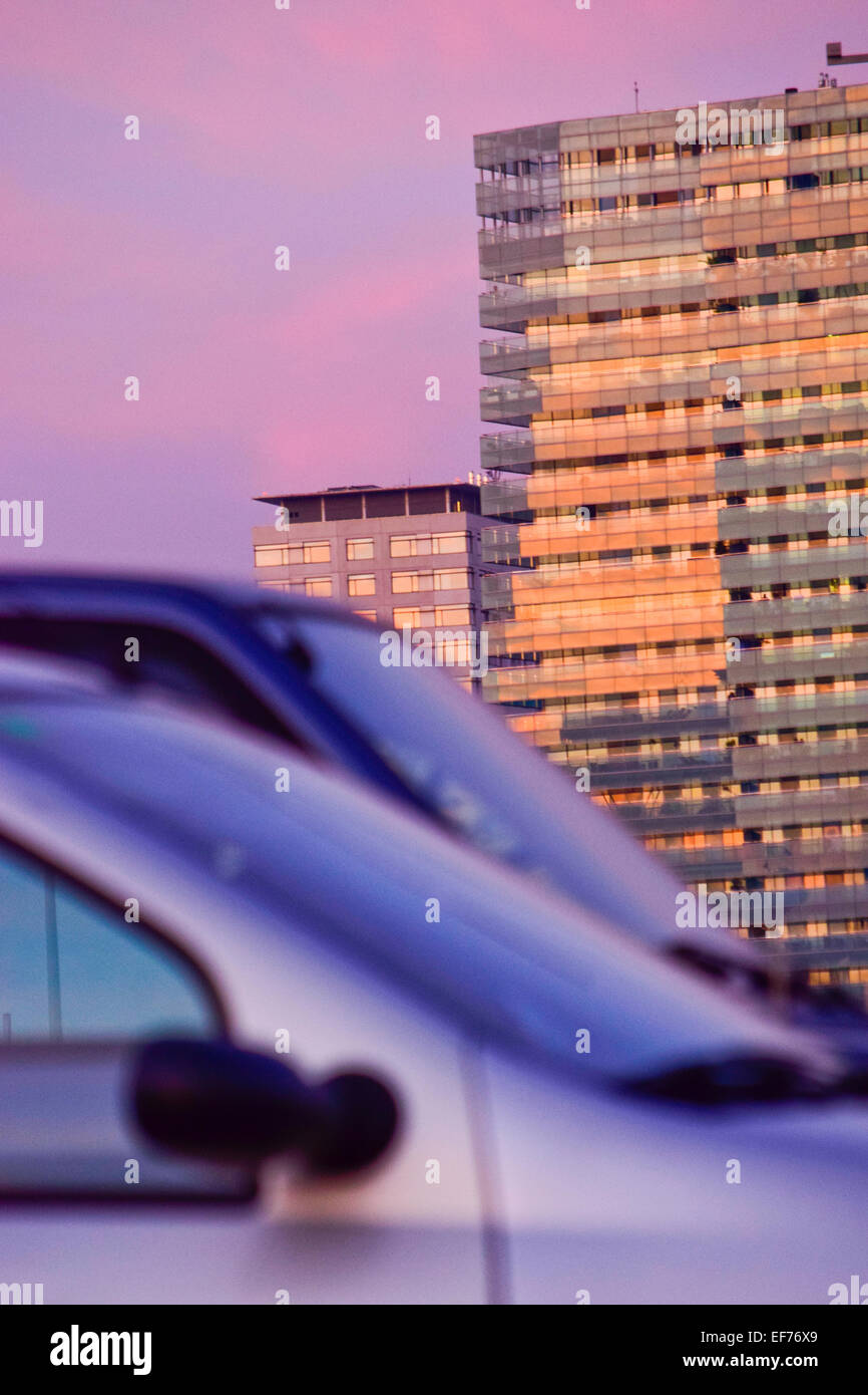 Close-up of two cars. Office building background. Transport to work ...