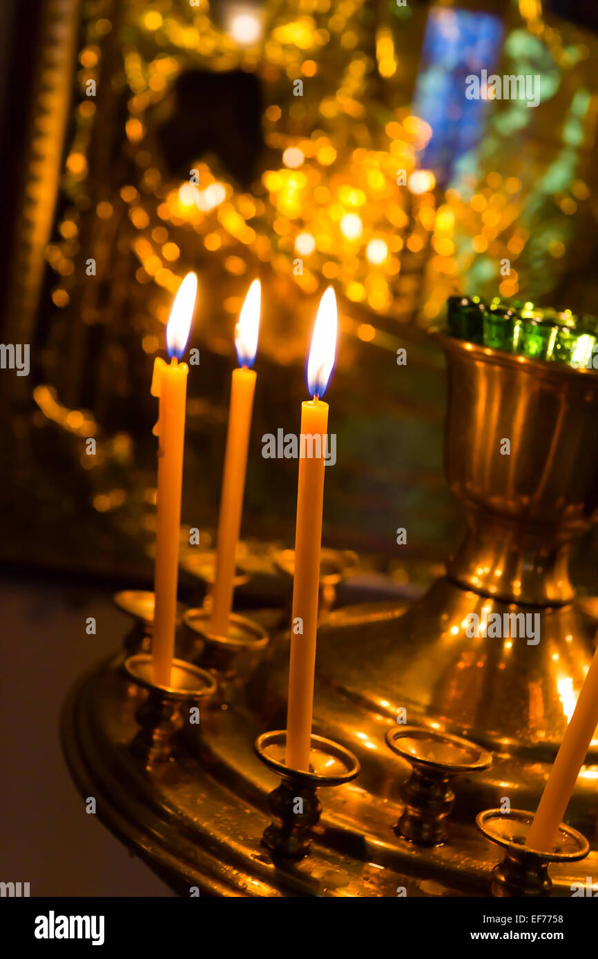 lighting candles in russian orthodox church Stock Photo - Alamy