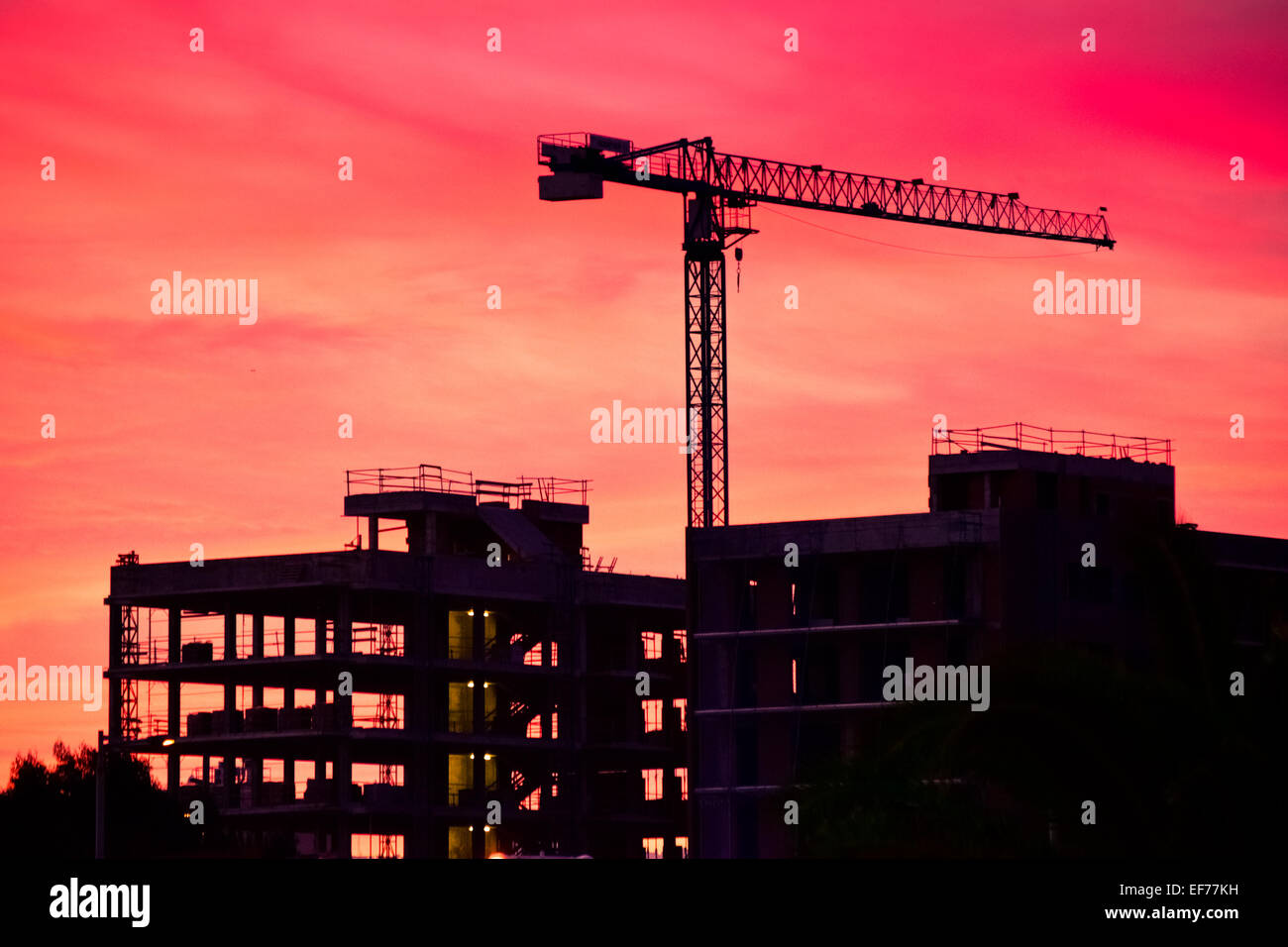 Building under construction at dusk Stock Photo - Alamy
