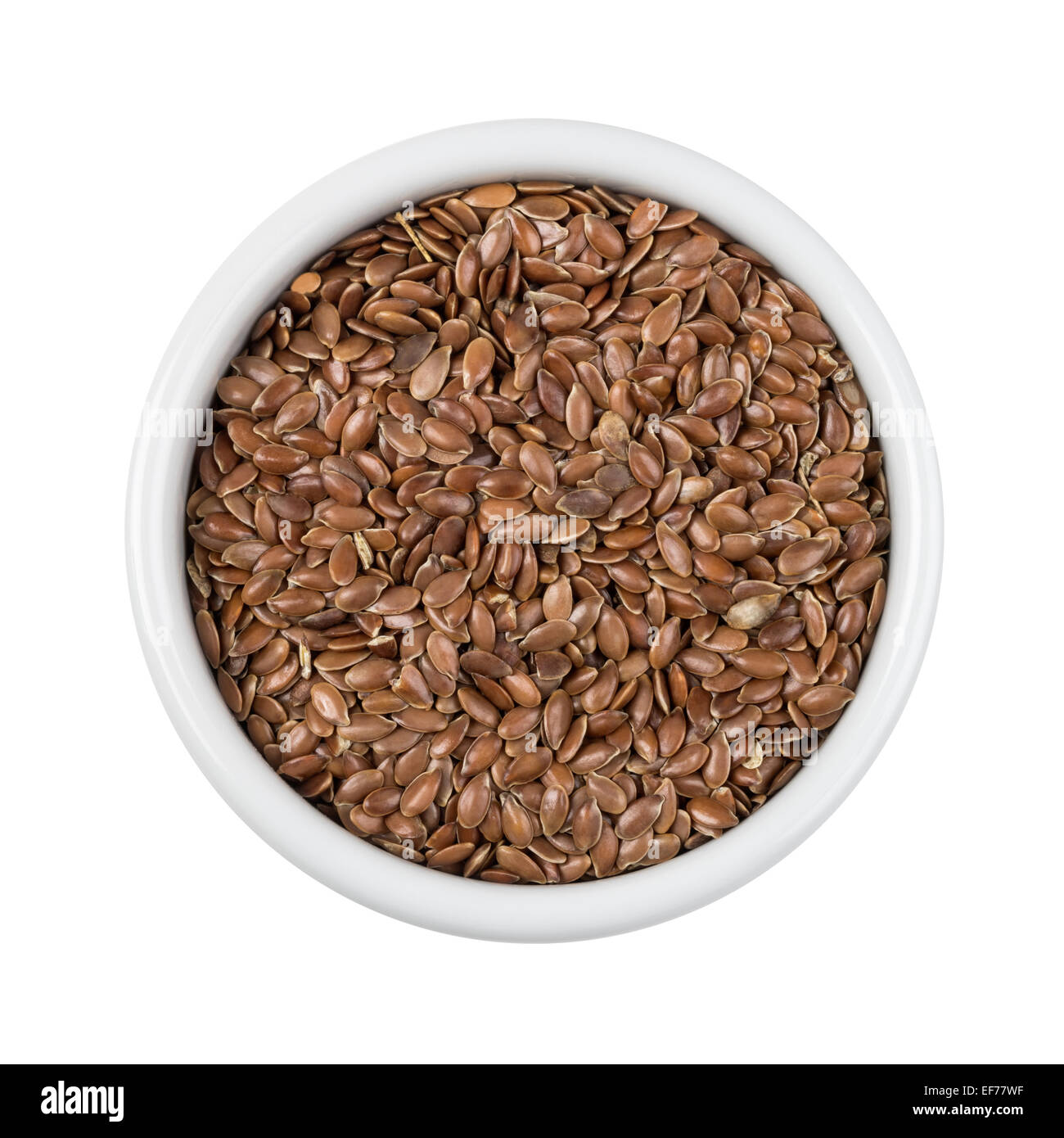 Flax seed in a white bowl isolated on white with clipping path Stock ...
