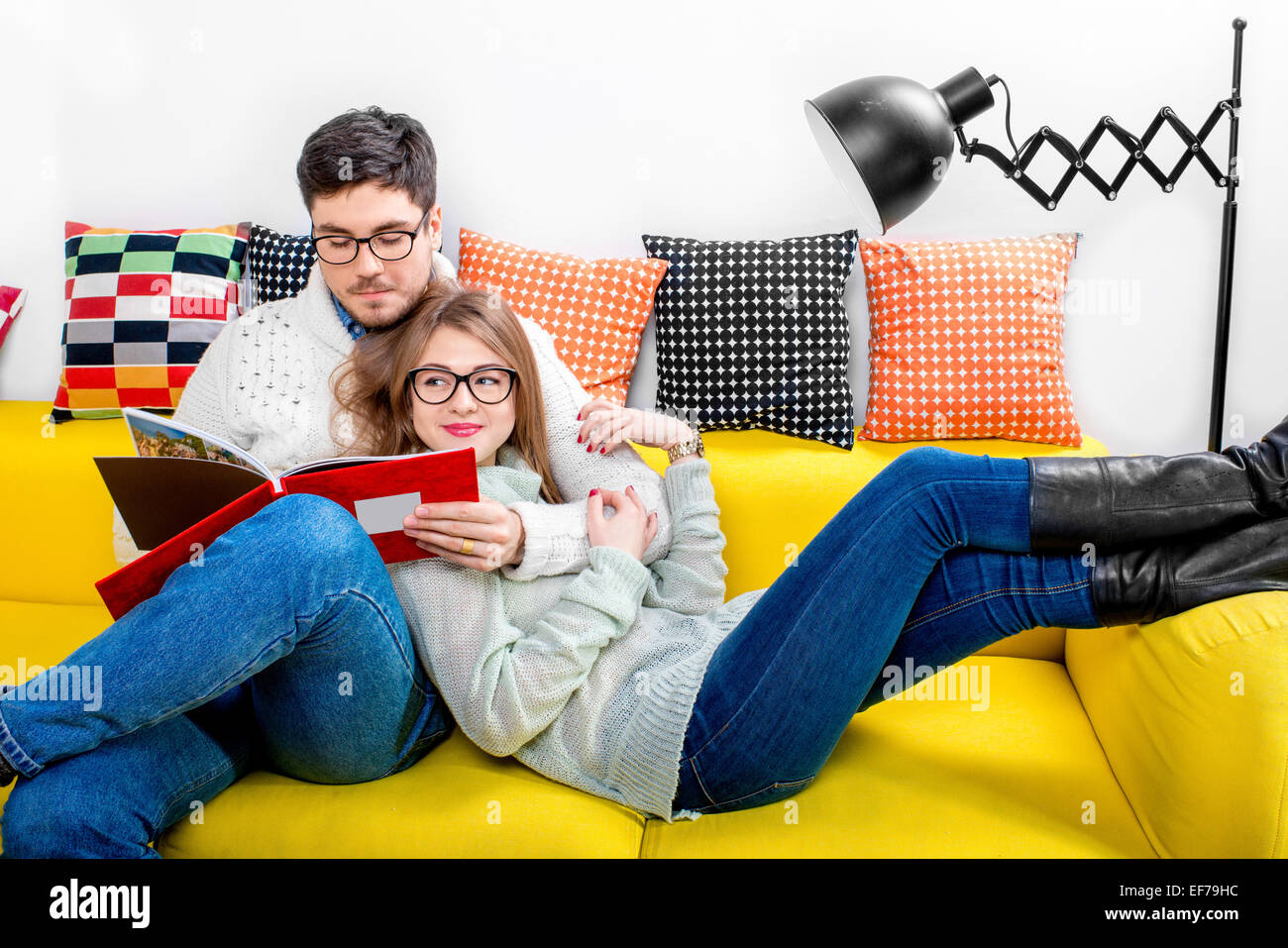 Couple lying on couch hi-res stock photography and images - Alamy