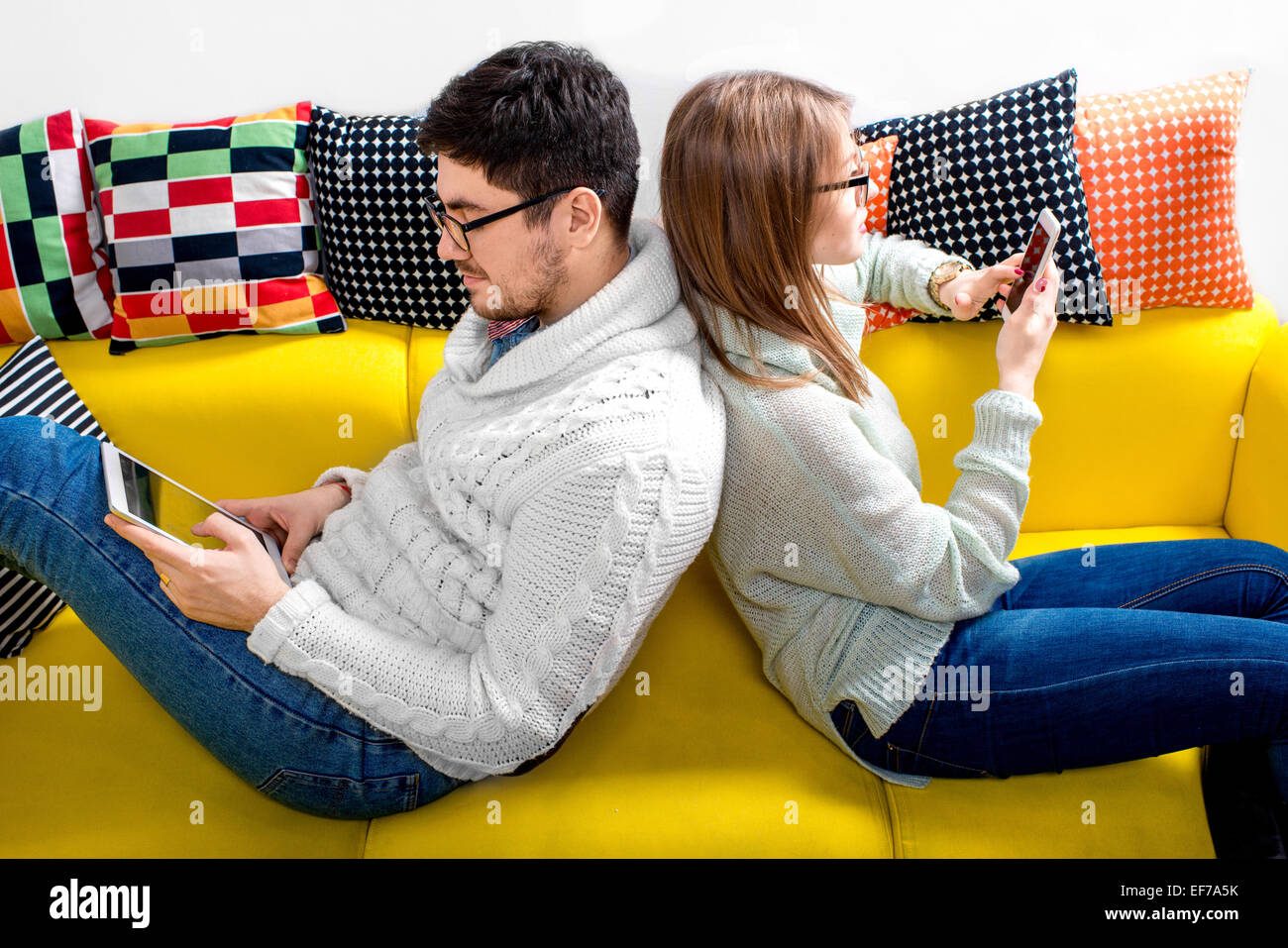 Relaxed couple sitting couch hi-res stock photography and images - Alamy