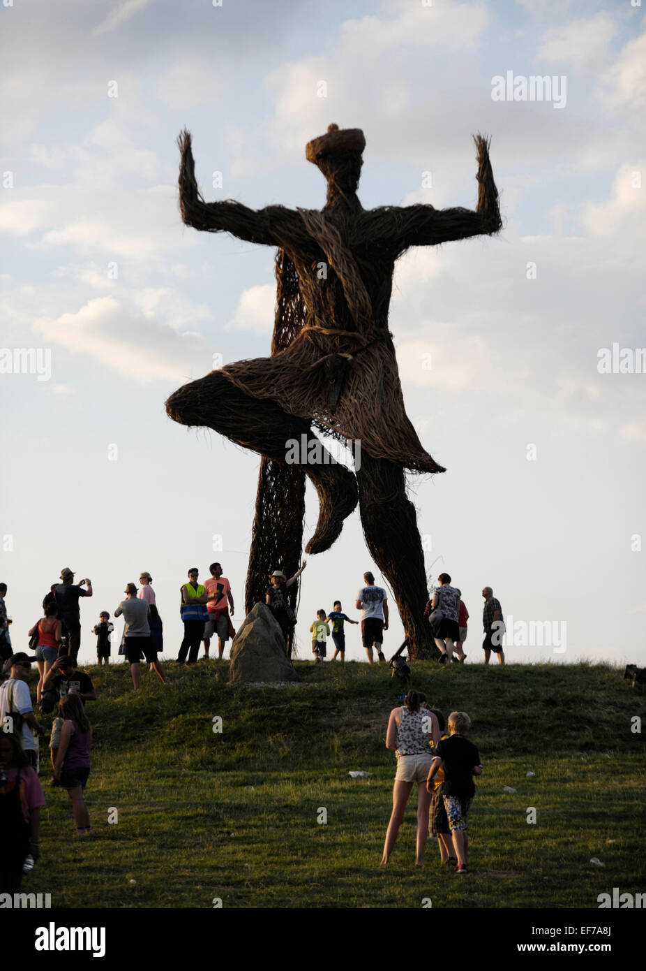 Music fans have a last look at the wicker man before it is burned at ...