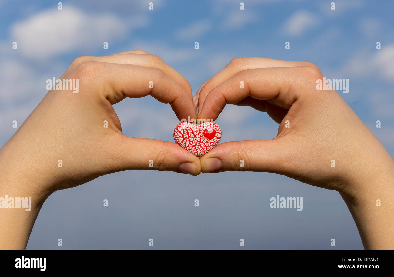 Hands holding broken heart hi-res stock photography and images - Alamy