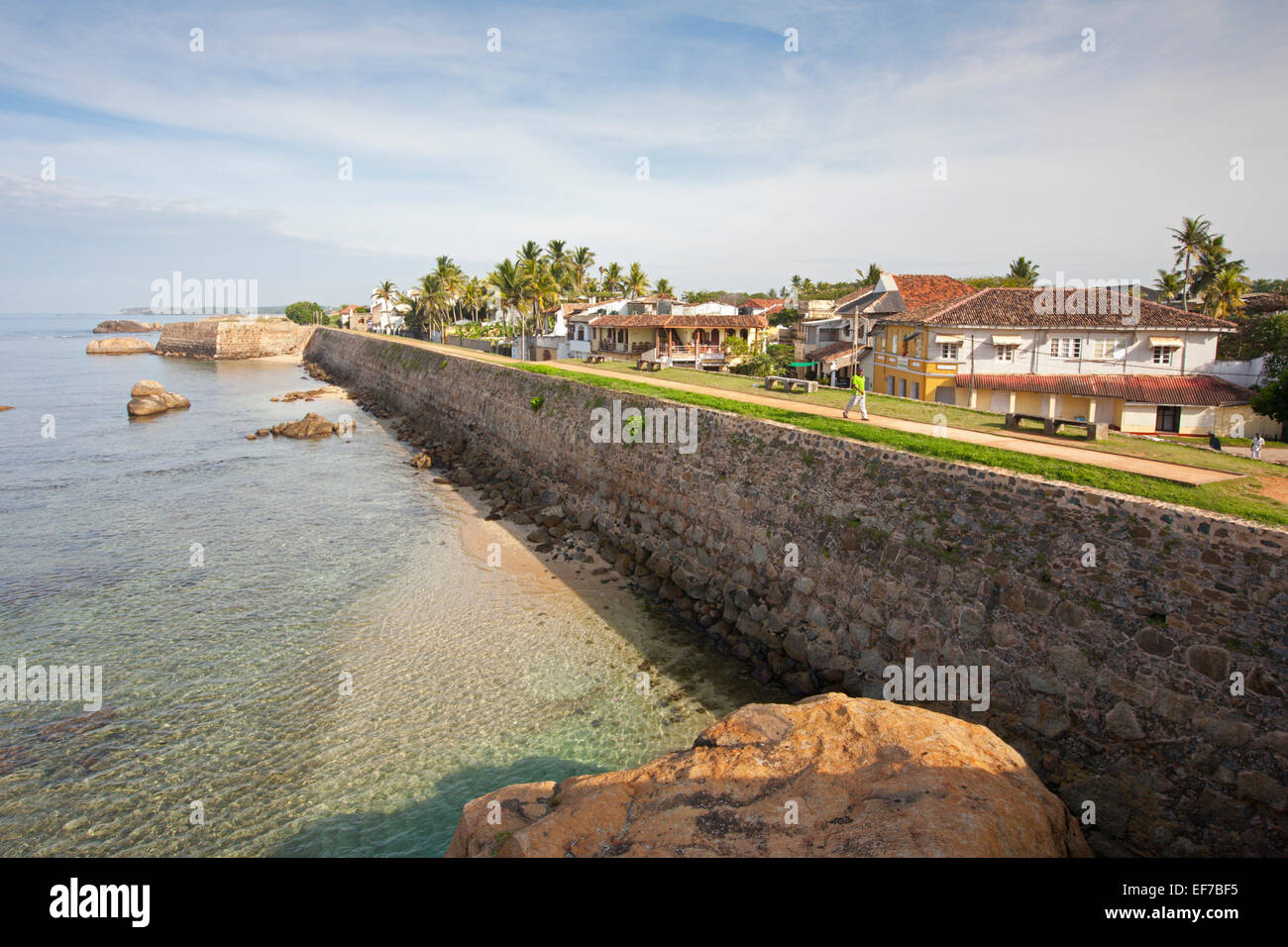 COLONIAL BUILDINGS AND PEOPLE WALKING ALONG FORT WALLS IN GALLE FORT ...