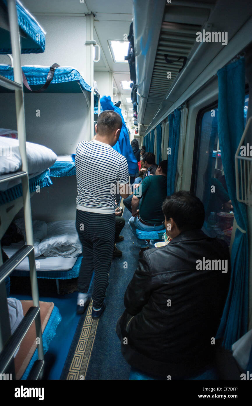 People in the corridor of a sleeping train that goes from Beijing to ...