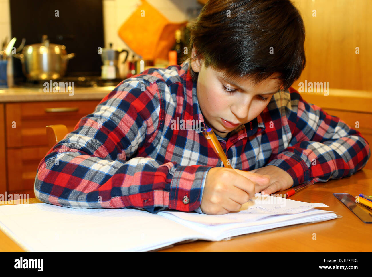 Teenage boy thinking notebook hi-res stock photography and images - Alamy