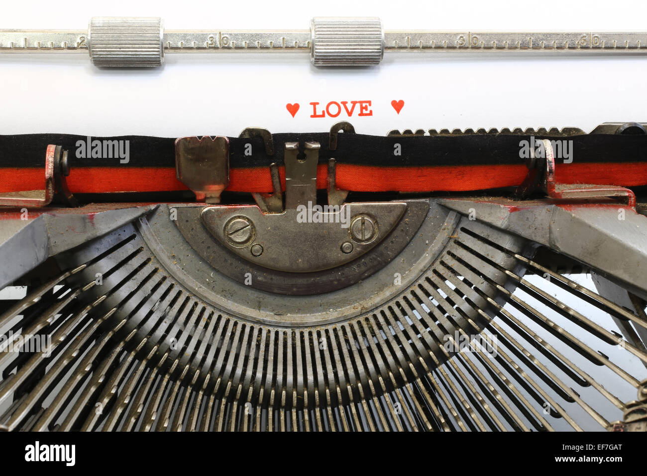 written typewriter LOVE and Hearts red ink Stock Photo - Alamy