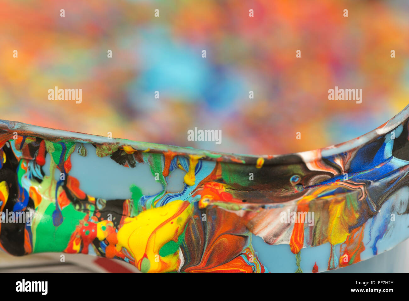 splattered colored paint creating abstract colorful drops of swirling ...