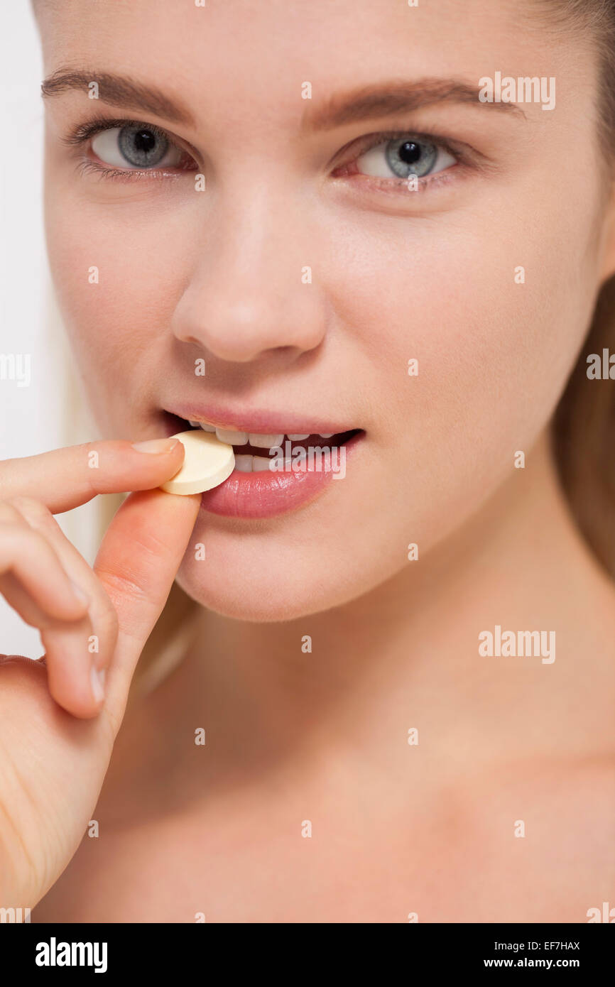 Beautiful woman taking pill Stock Photo - Alamy Beautiful woman taking pill Stock Photo - Alamy