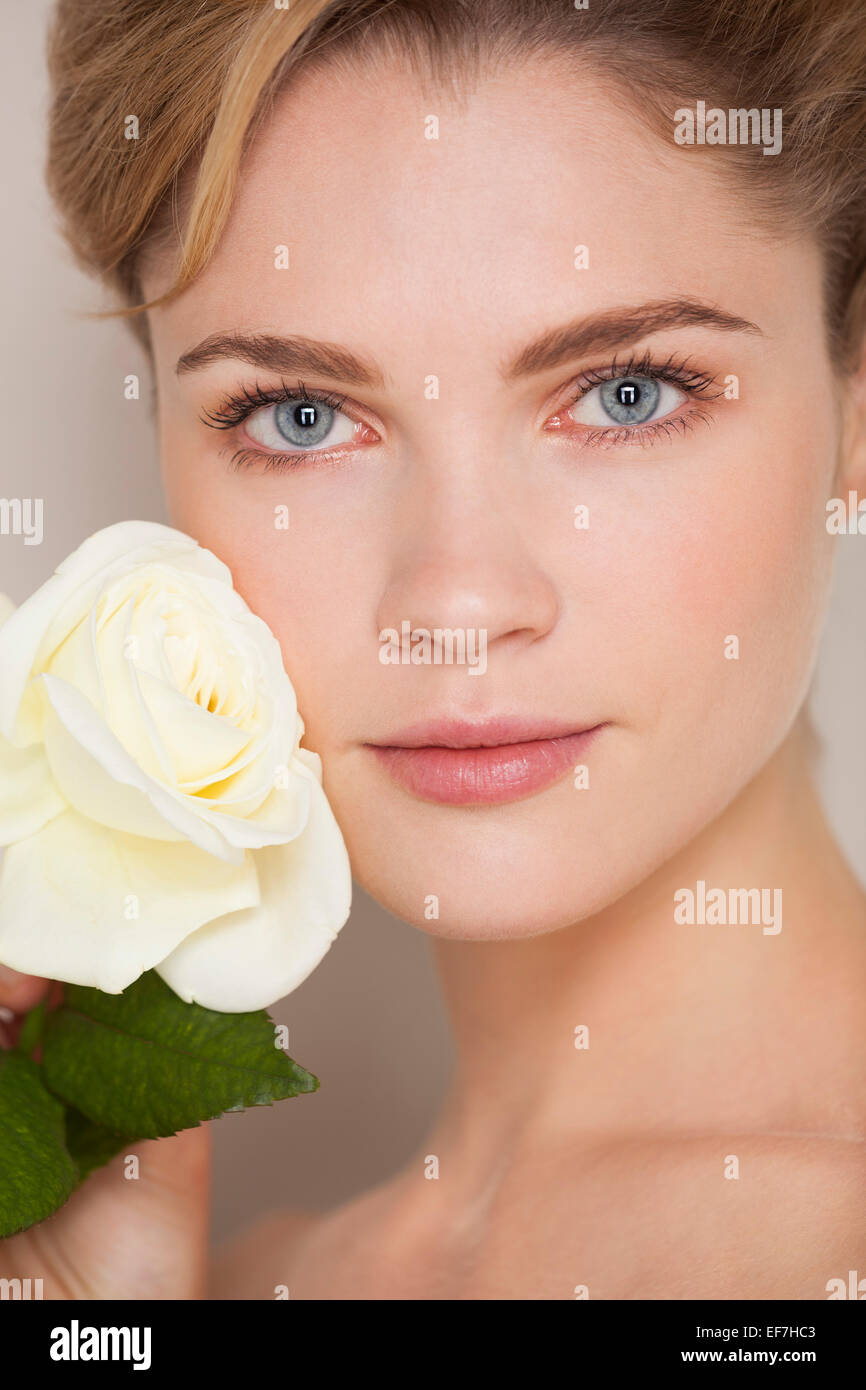 Beautiful woman touching face hi-res stock photography and images - Alamy