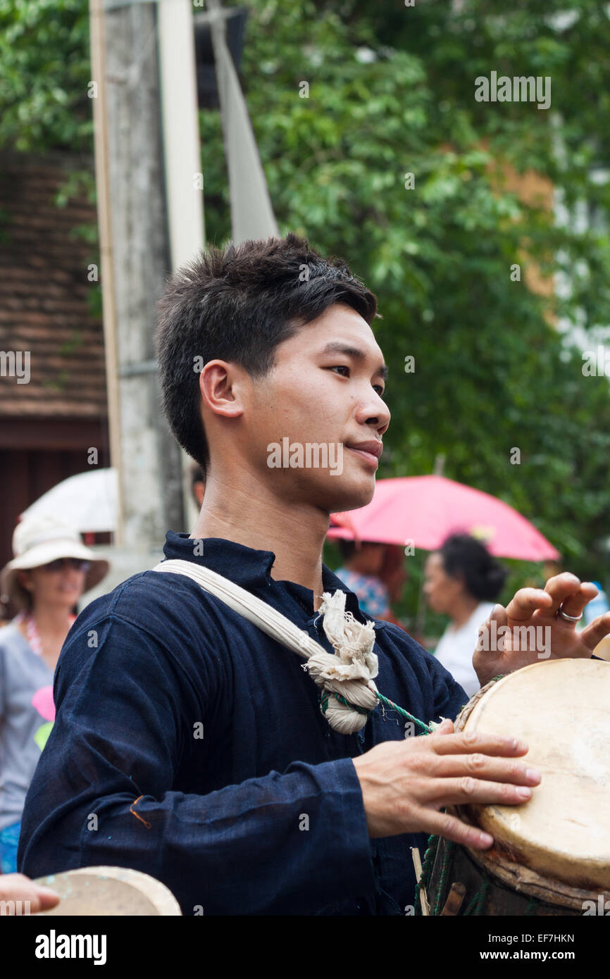 A young man playing drum in Luang Prabang Pi Mai parade, Laos Stock ...