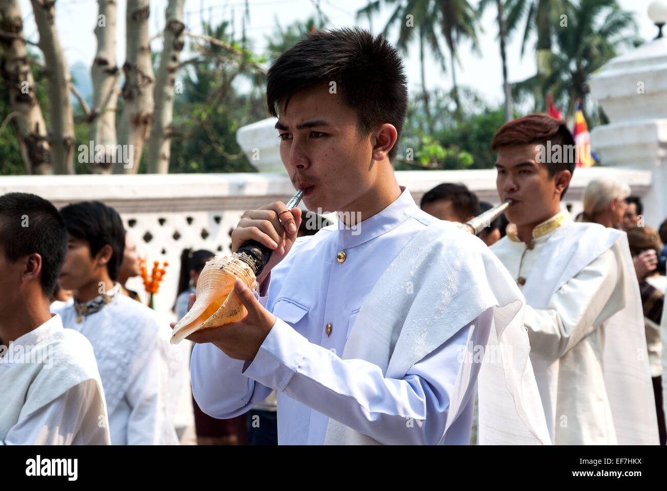 Man blowing conch shell hi-res stock photography and images - Alamy