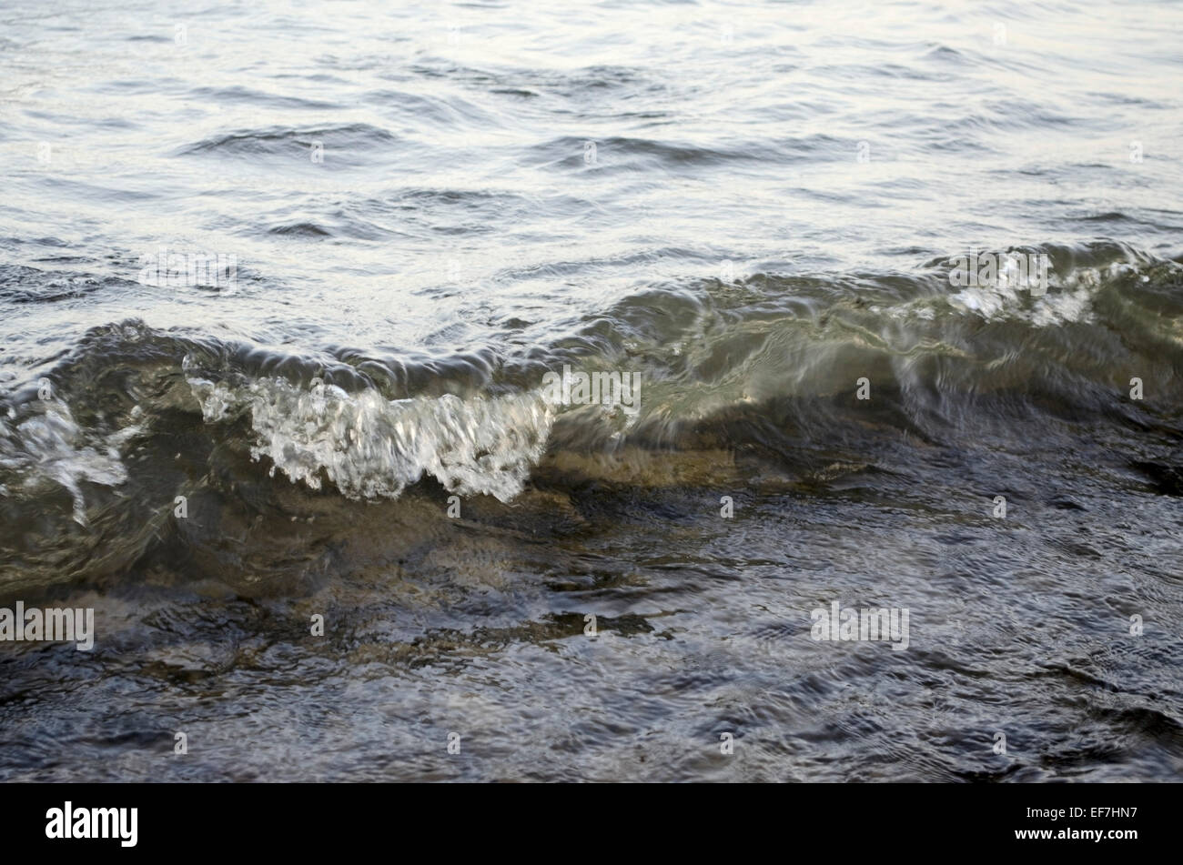 Calm tide off the coast of lakes Stock Photo - Alamy