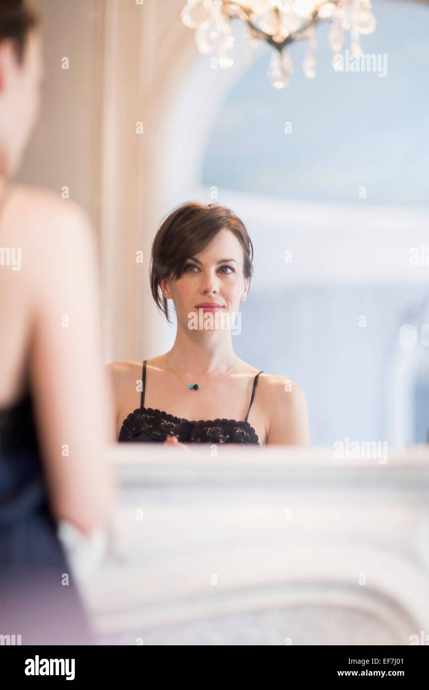 Reflection of a woman in mirror Stock Photo - Alamy