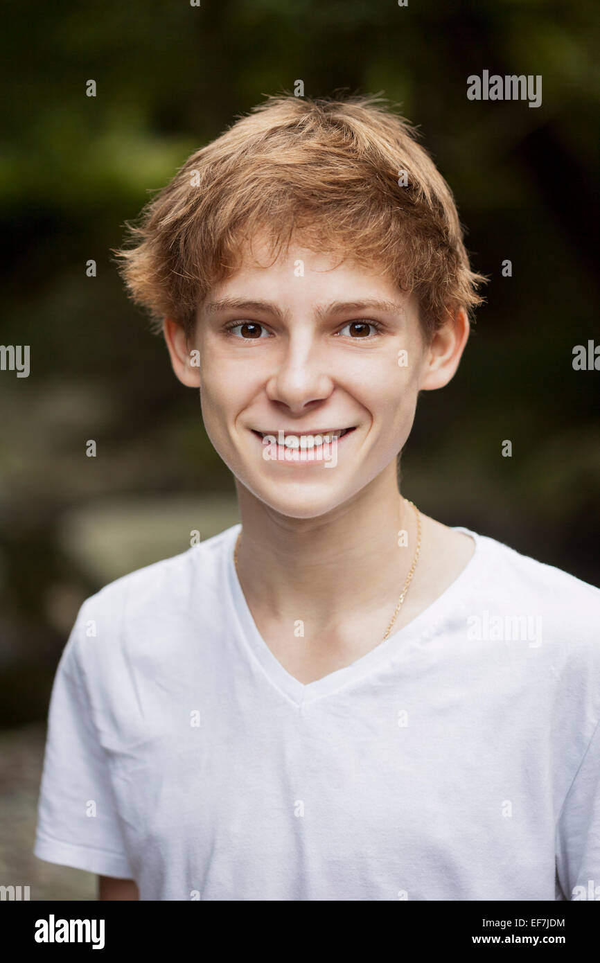 Portrait of a teenage boy smiling Stock Photo - Alamy