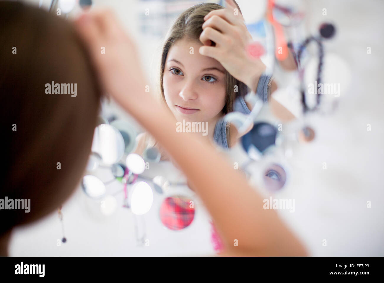 Girl looking at mirror Stock Photo - Alamy