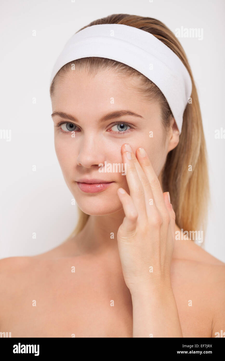 Portrait of a beautiful woman touching her face Stock Photo - Alamy